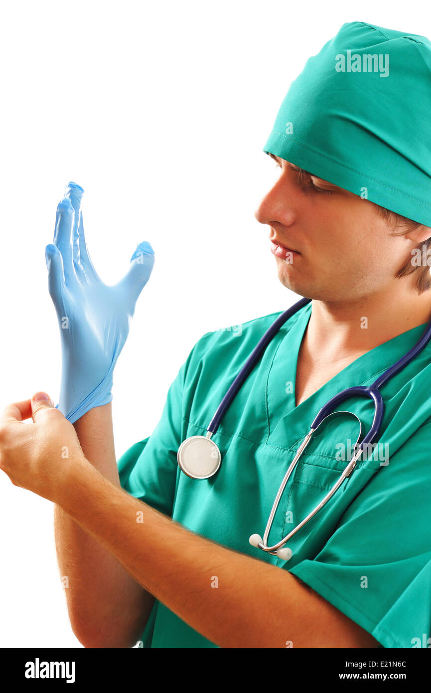 Pulling on surgical glove Stock Photo - Alamy