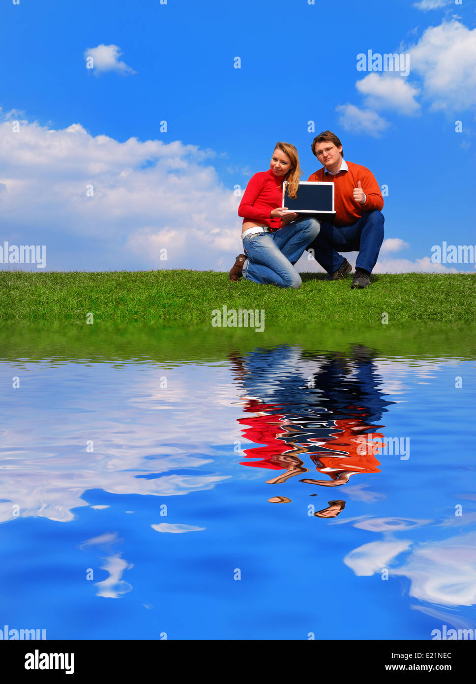 Couple with notebook Stock Photo - Alamy