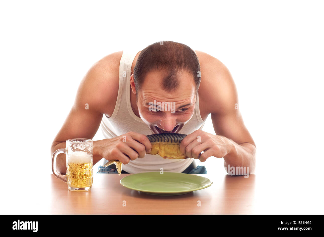 angry man eating fish Stock Photo - Alamy