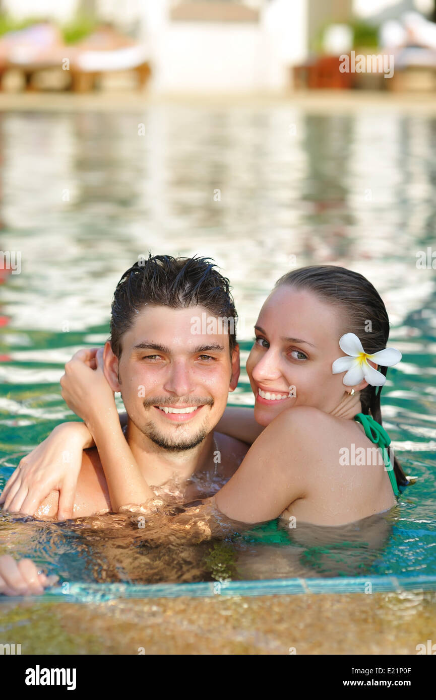 Couple in pool Stock Photo - Alamy