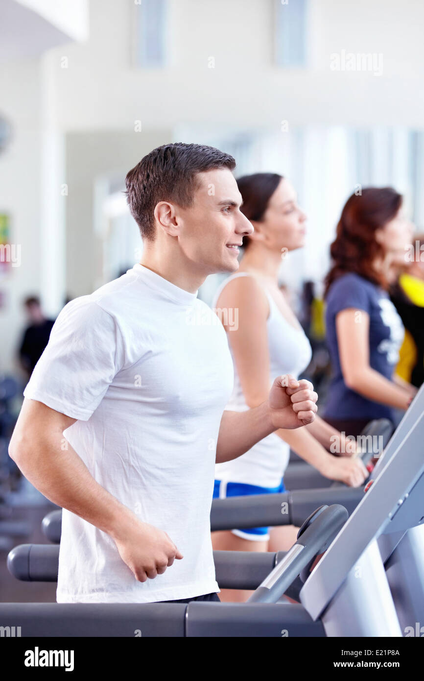 Attractive people on the treadmill Stock Photo - Alamy