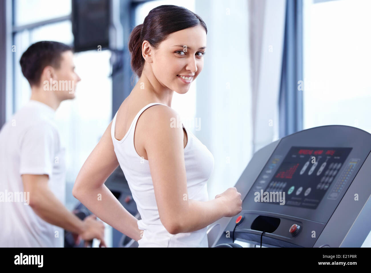 An attractive young woman on a treadmill Stock Photo - Alamy