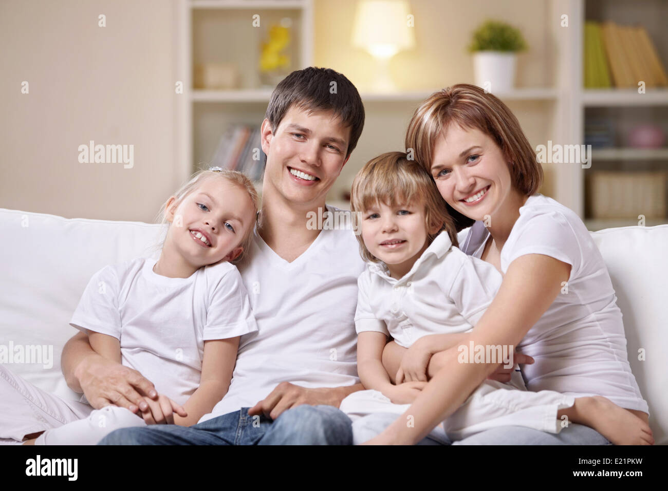 Family at home Stock Photo - Alamy