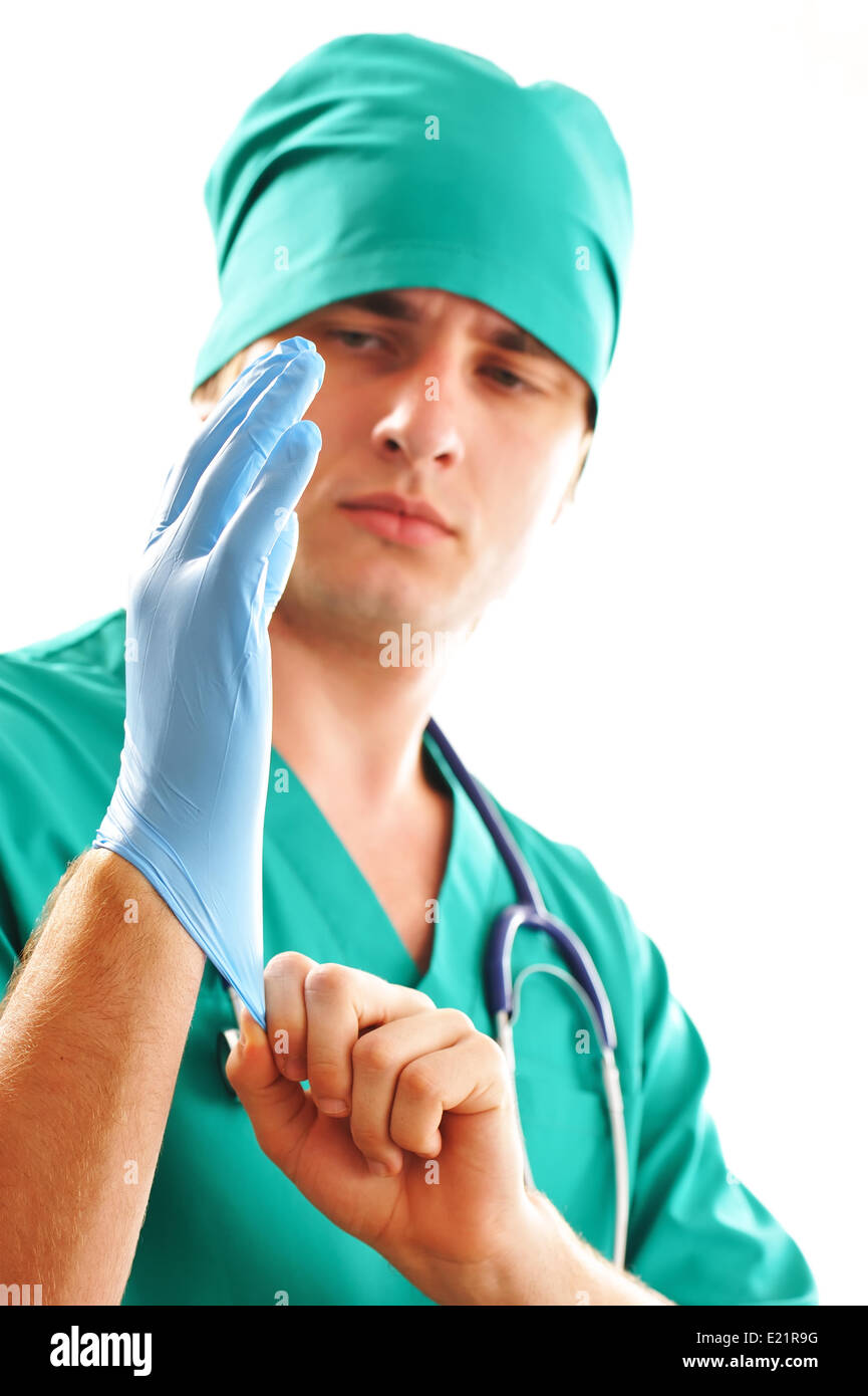 Pulling on surgical glove Stock Photo - Alamy