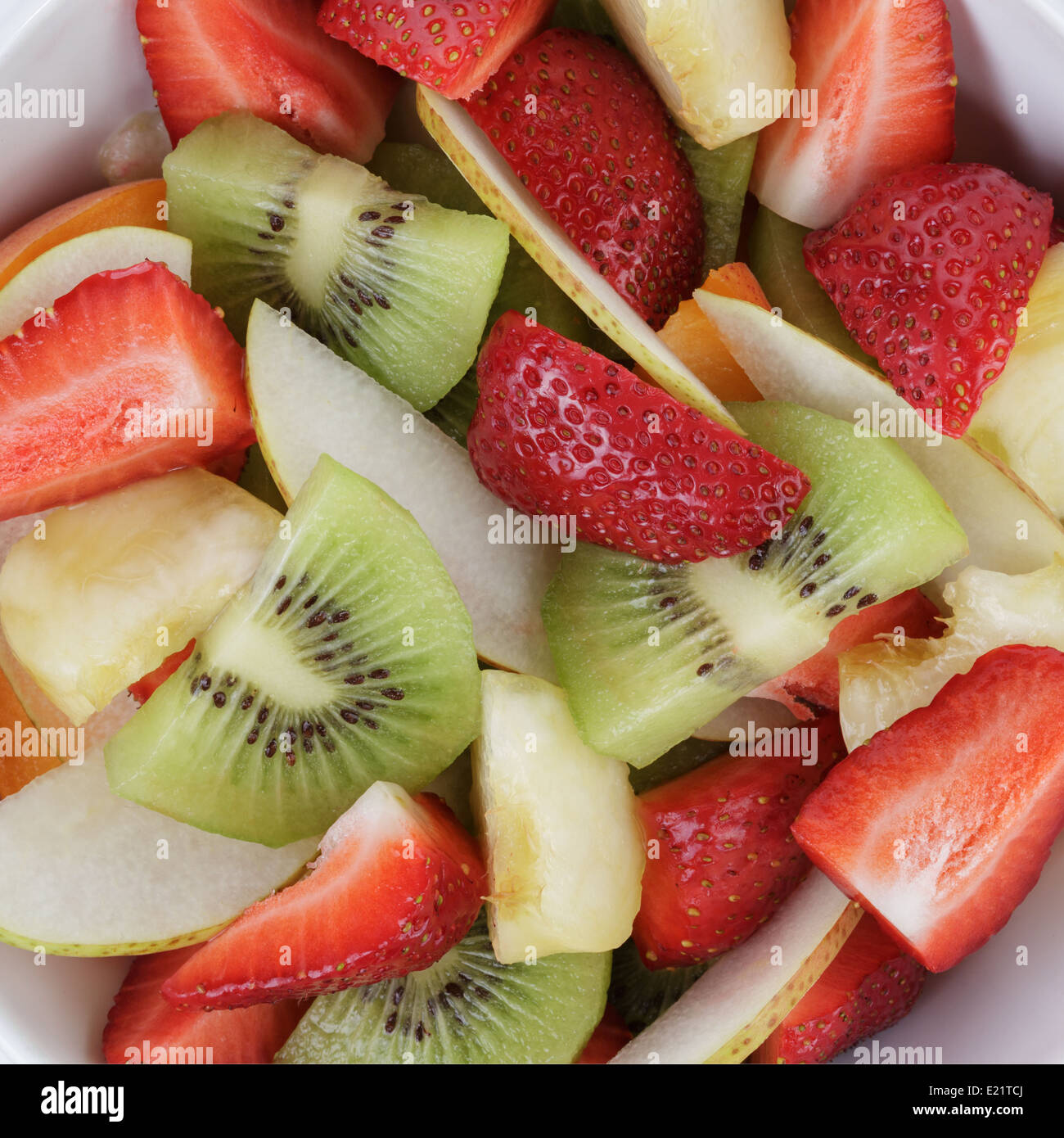 fresh mix fruit salad with strawberry, kiwi and peach, close up ...
