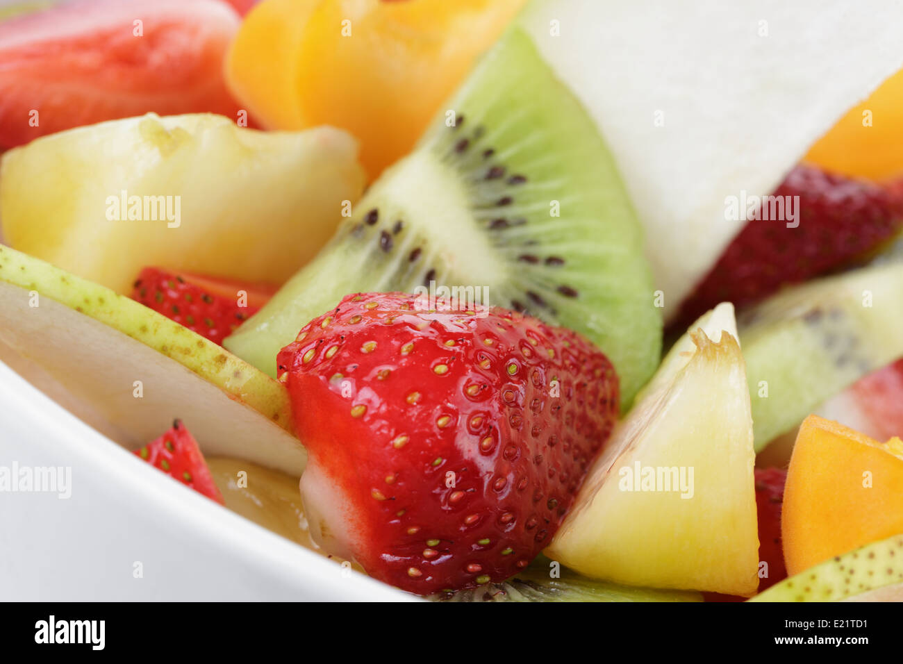 fresh mix fruit salad with strawberry, kiwi and peach, close up Stock ...