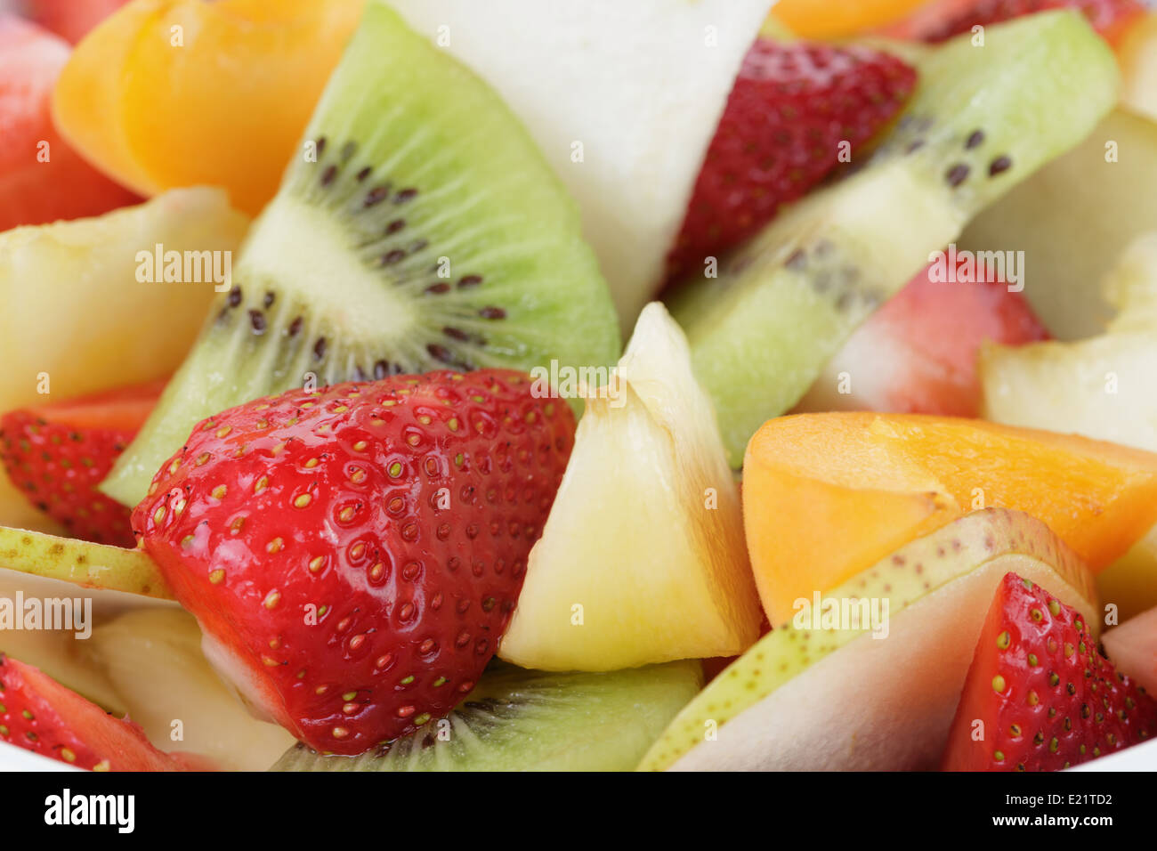 fresh mix fruit salad with strawberry, kiwi and peach, close up Stock ...
