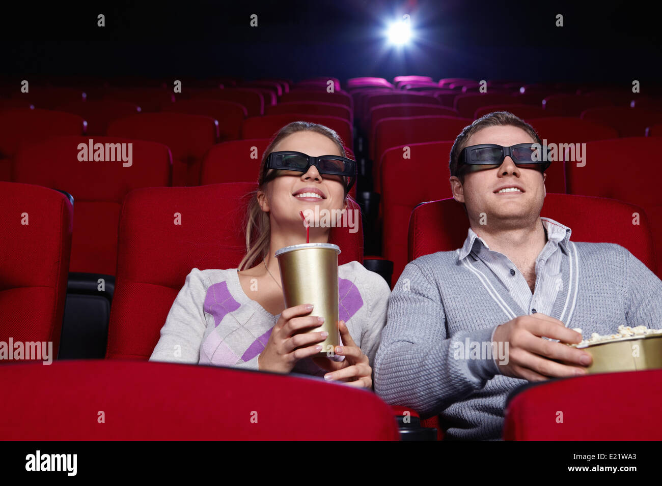Couple at cinema Stock Photo - Alamy