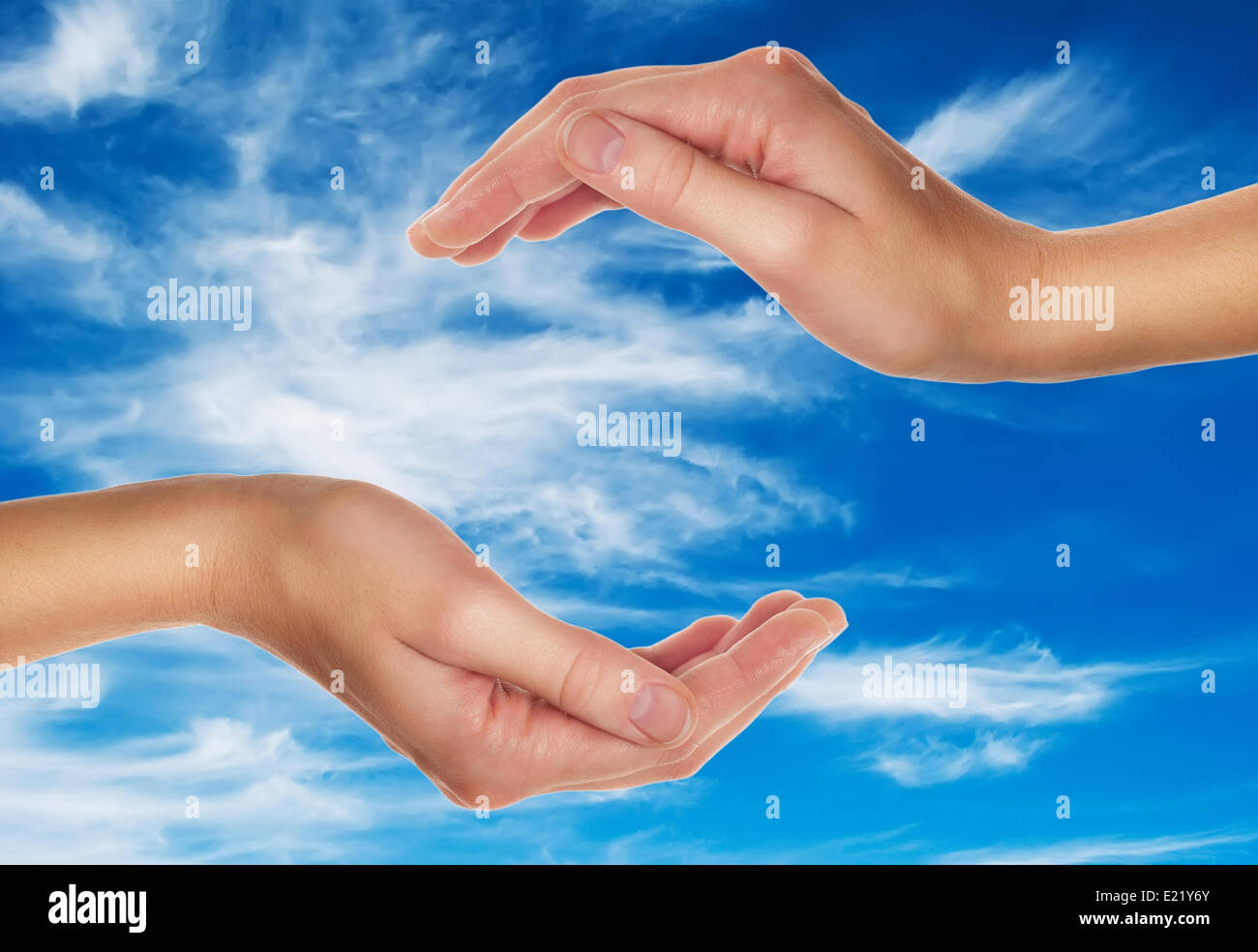 female hands over blue sky with clouds Stock Photo - Alamy