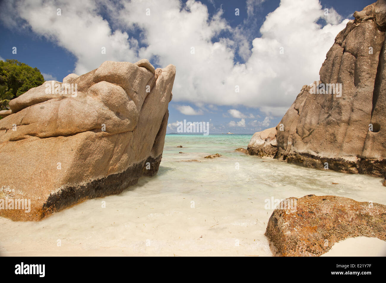Tropical beach with rocks Stock Photo - Alamy