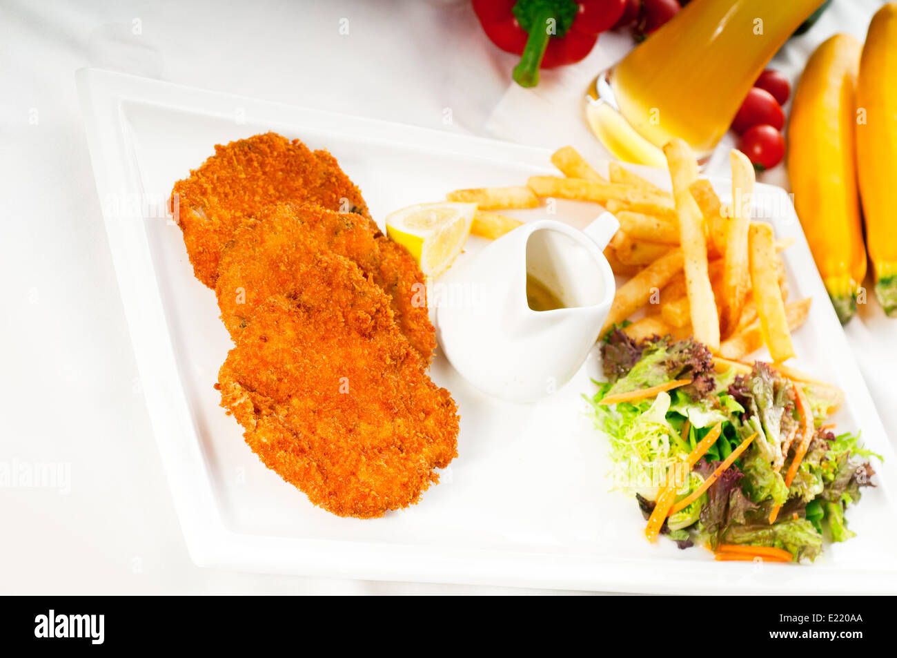 classic Milanese veal cutlets and vegetables Stock Photo - Alamy