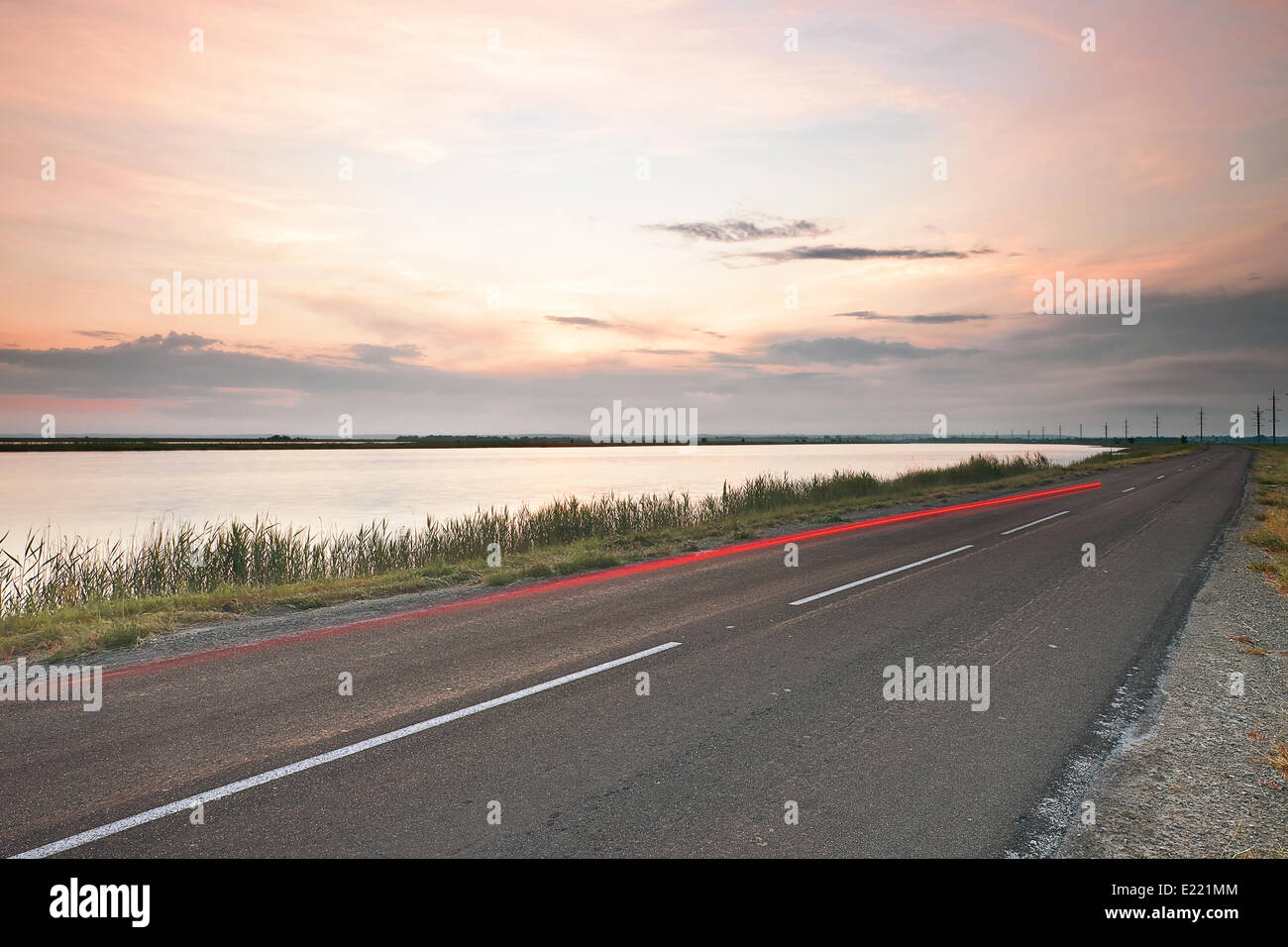beautiful sunset over country road Stock Photo - Alamy