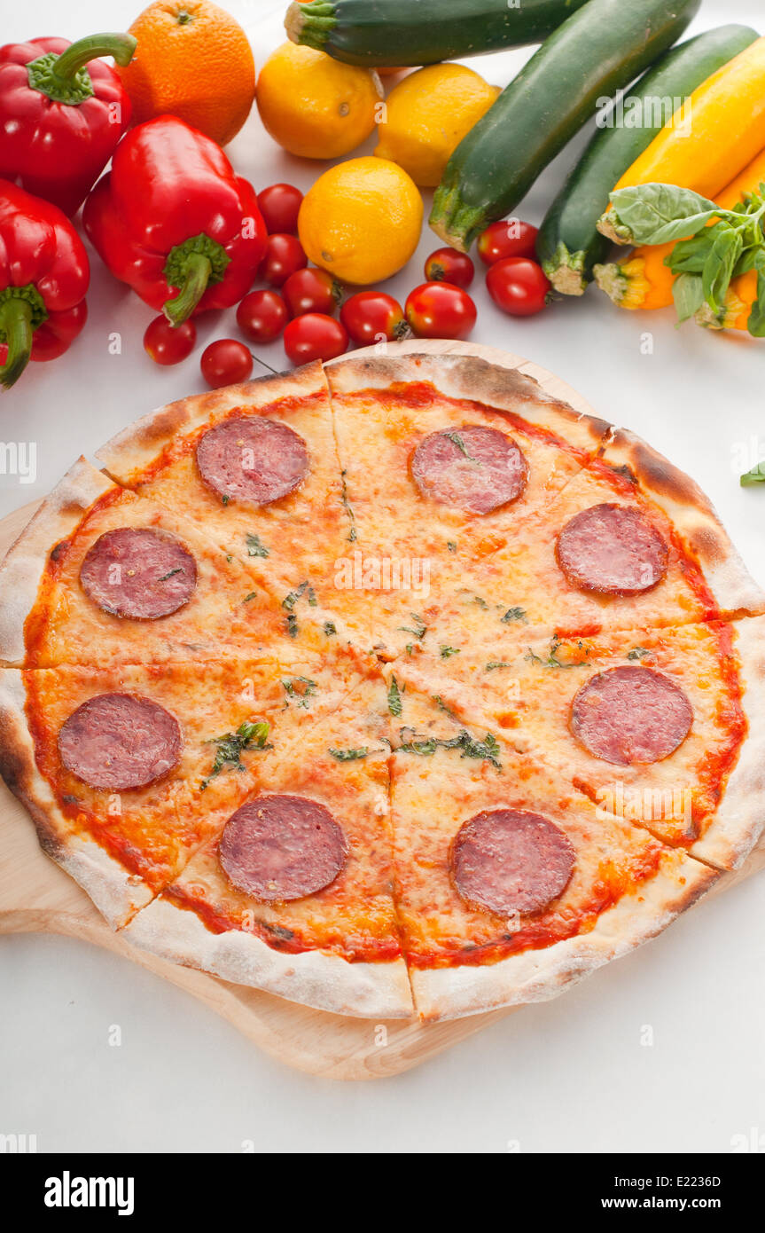 Italian original thin crust pepperoni pizza Stock Photo - Alamy