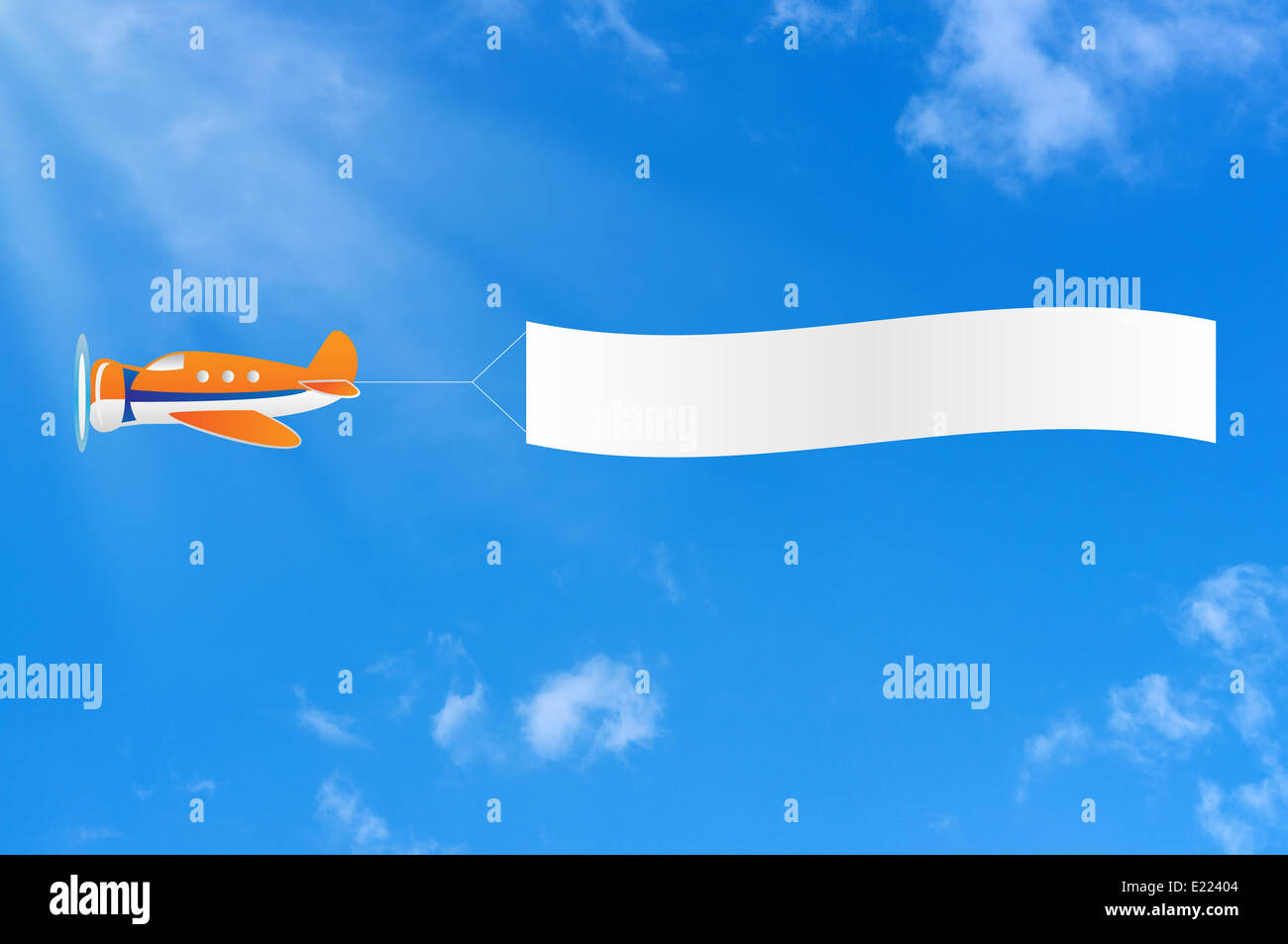 Flying aircraft carries banner in sky Stock Photo - Alamy