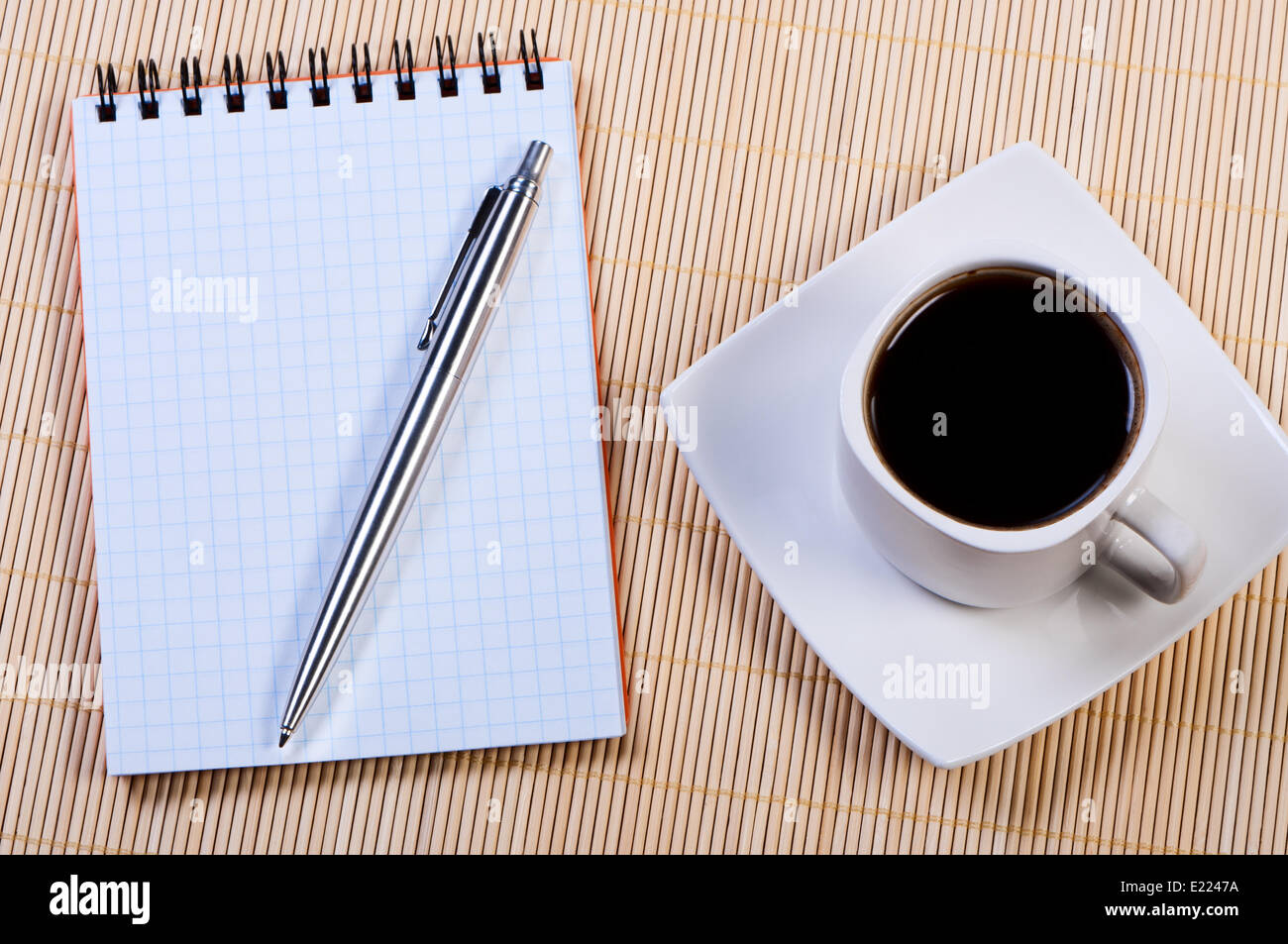 Notepad with pen and cup coffee Stock Photo - Alamy