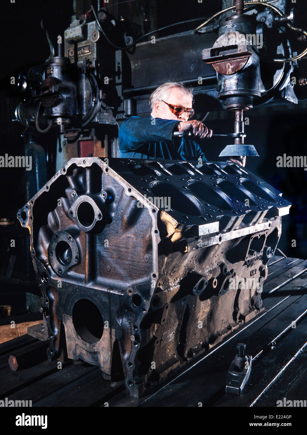 Engineer working on engine block Stock Photo - Alamy