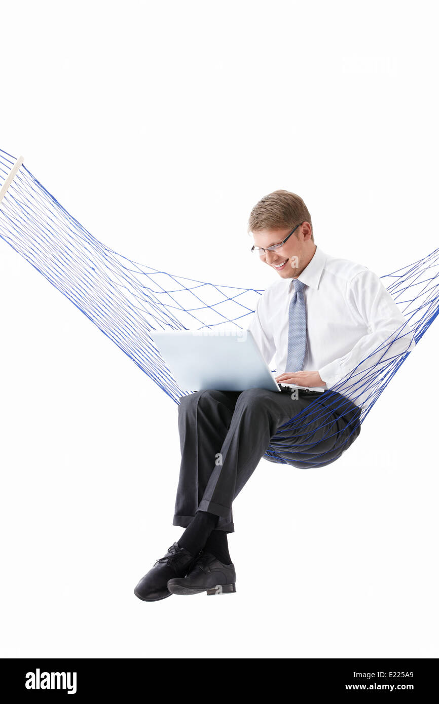 Young man with laptop Stock Photo - Alamy