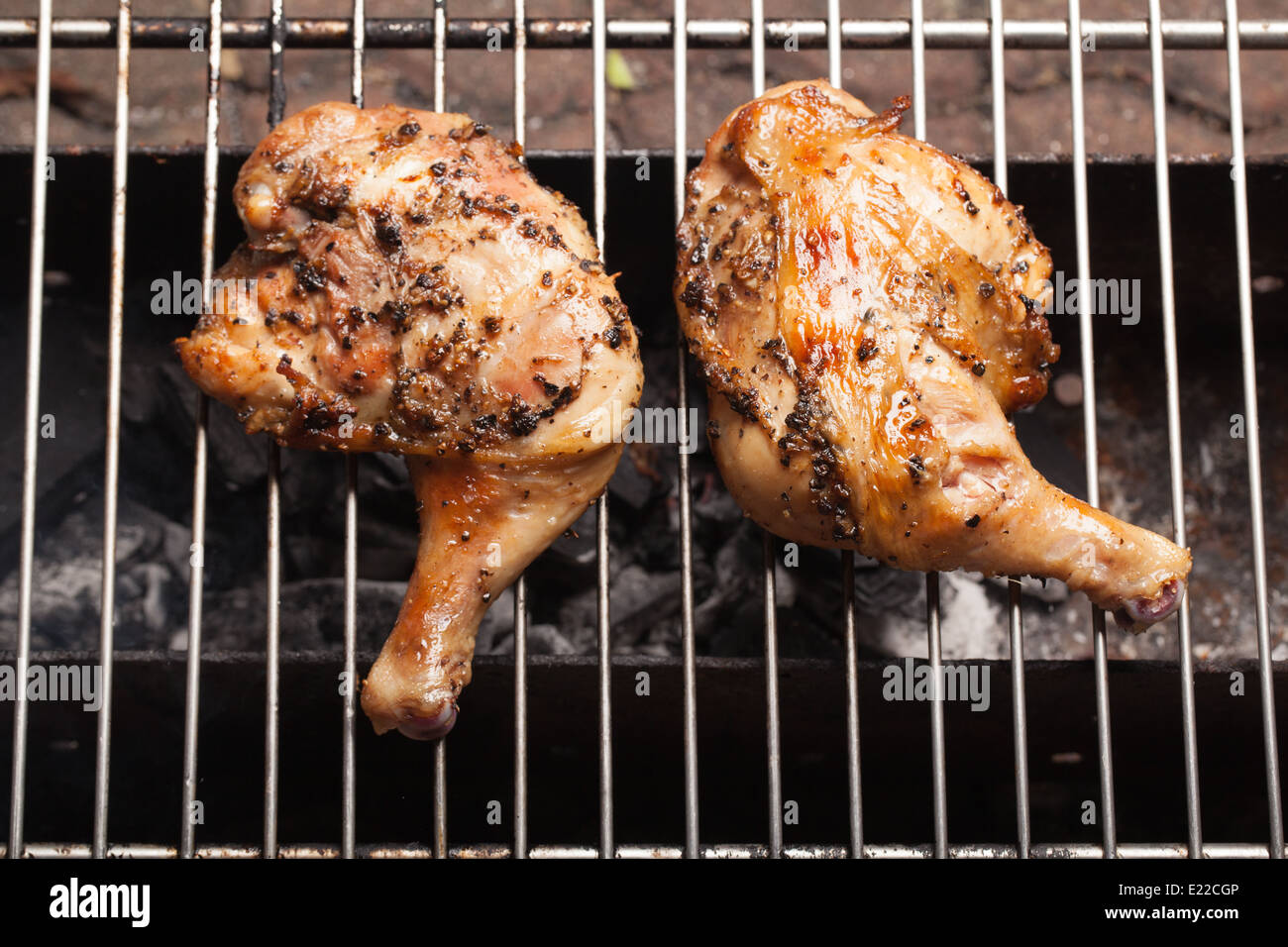 Roasting chicken with smoke from stove Stock Photo - Alamy