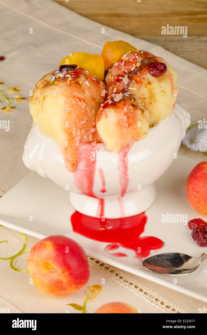 Ice cream with strawberry syrup staring to melt away Stock Photo - Alamy