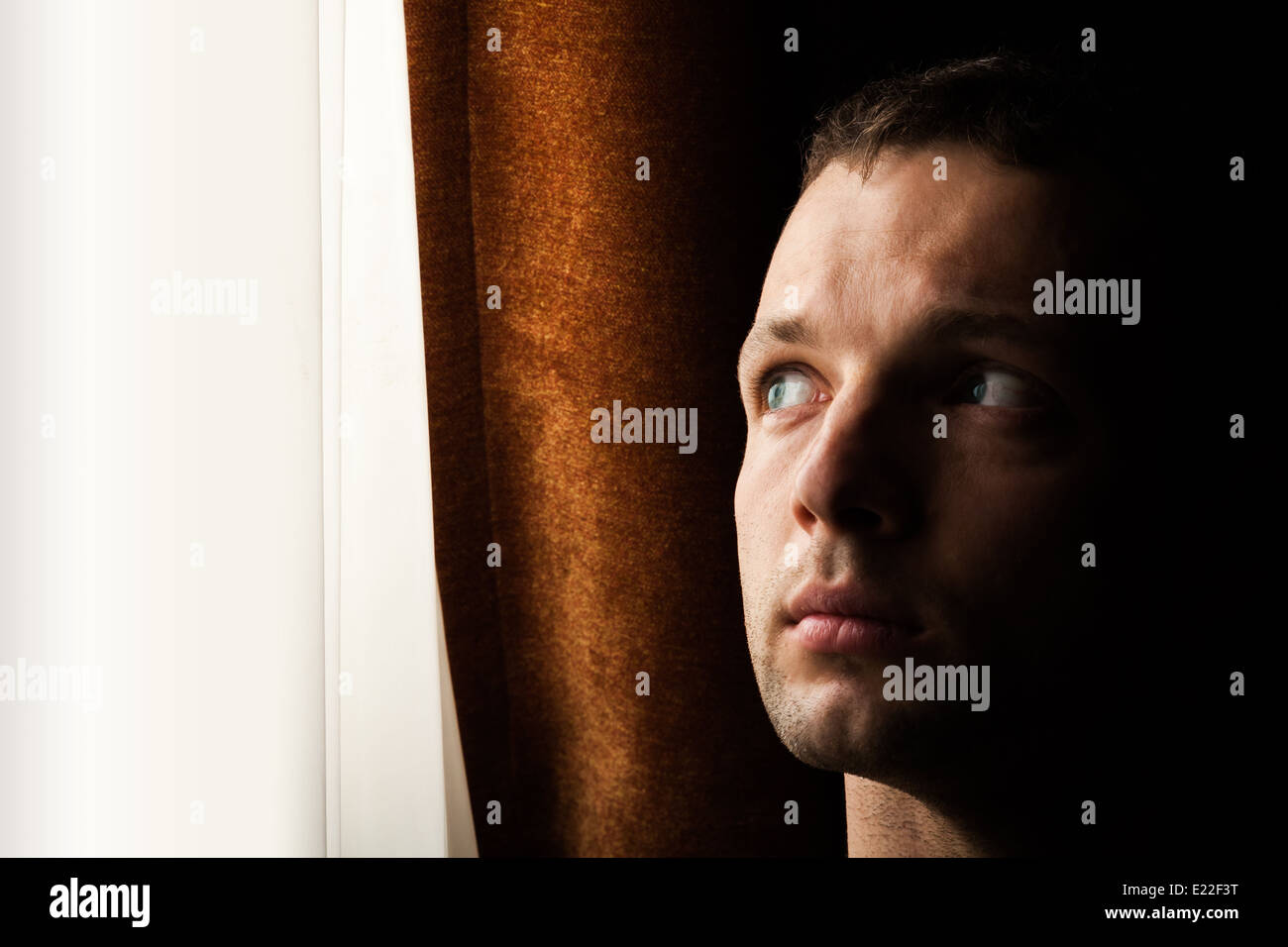 Sad man window hi-res stock photography and images - Alamy