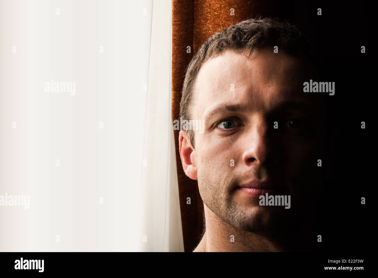 Man face looking up close up shadow hi-res stock photography and images ...