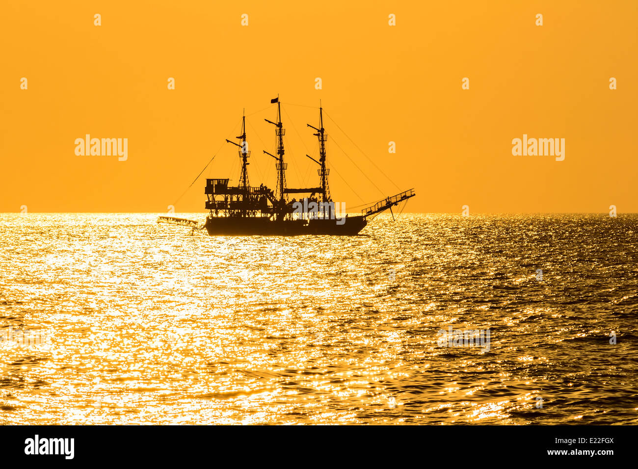 silhouette of the ancient ship at sunset Stock Photo - Alamy