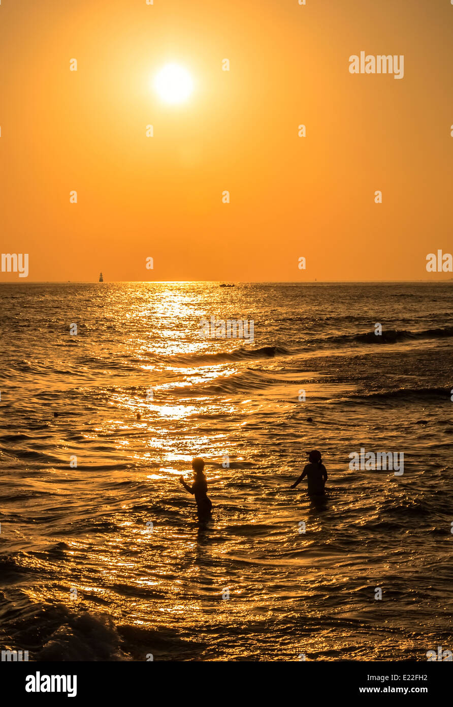 Person swimming in the ocean at sunset hi-res stock photography and ...