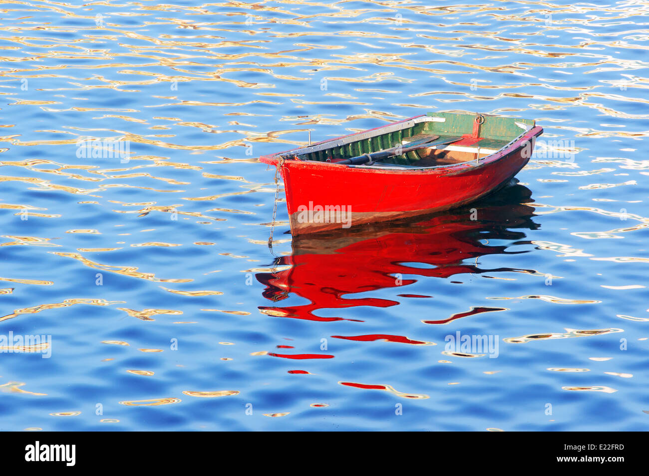 boat on water with red vivid color Stock Photo - Alamy
