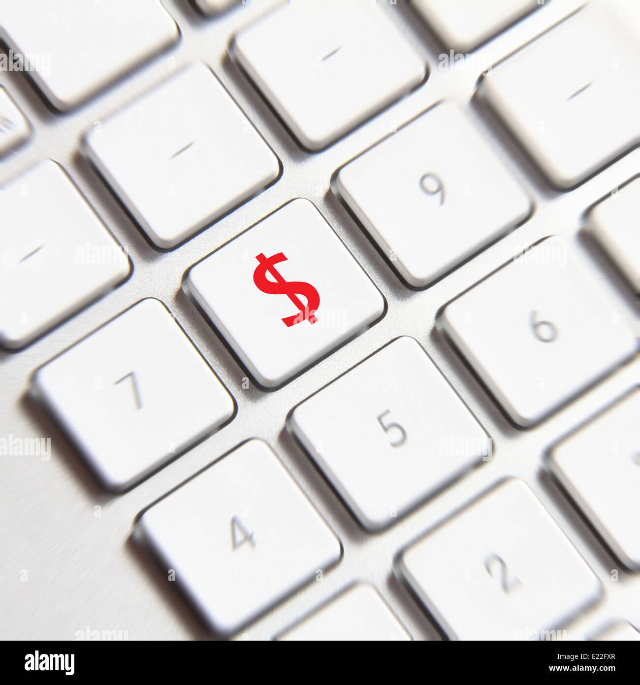 Photo of money symbol button on the white keyboard Stock Photo - Alamy
