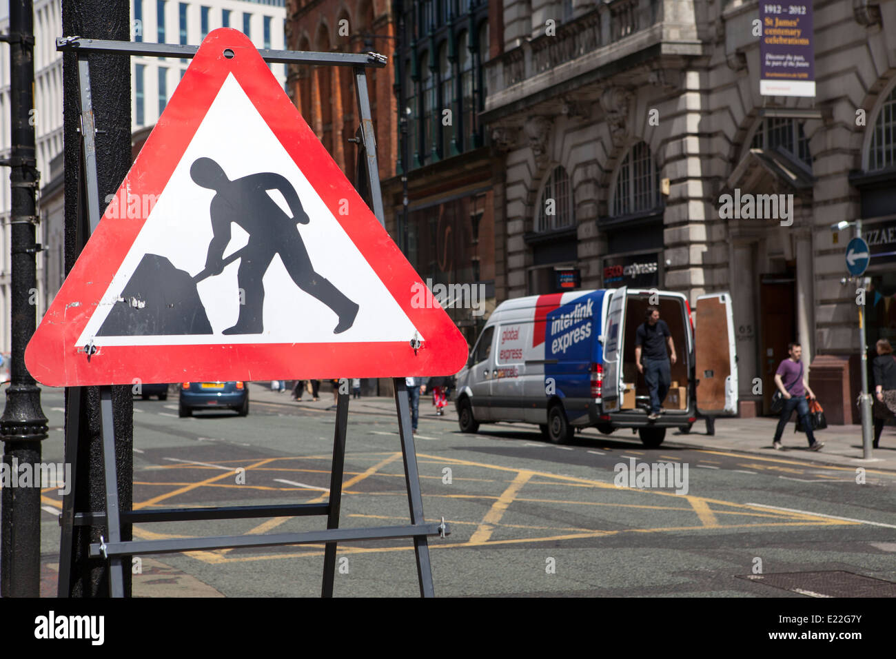 Work in progress, warning sign of road works, Deansgate, Manchester, UK ...