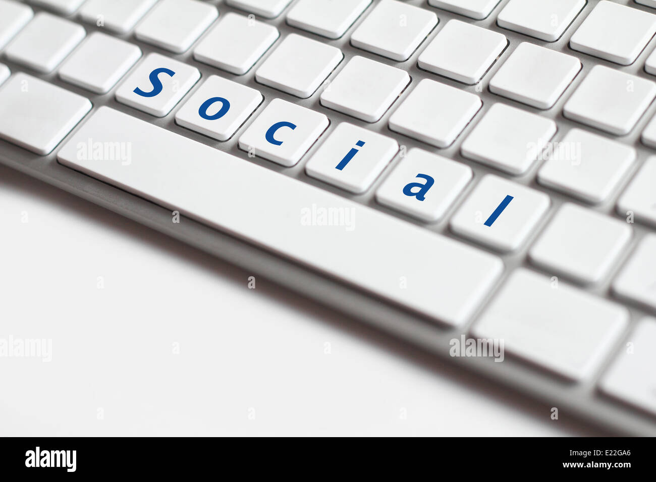 Photo of social button on the white keyboard Stock Photo - Alamy