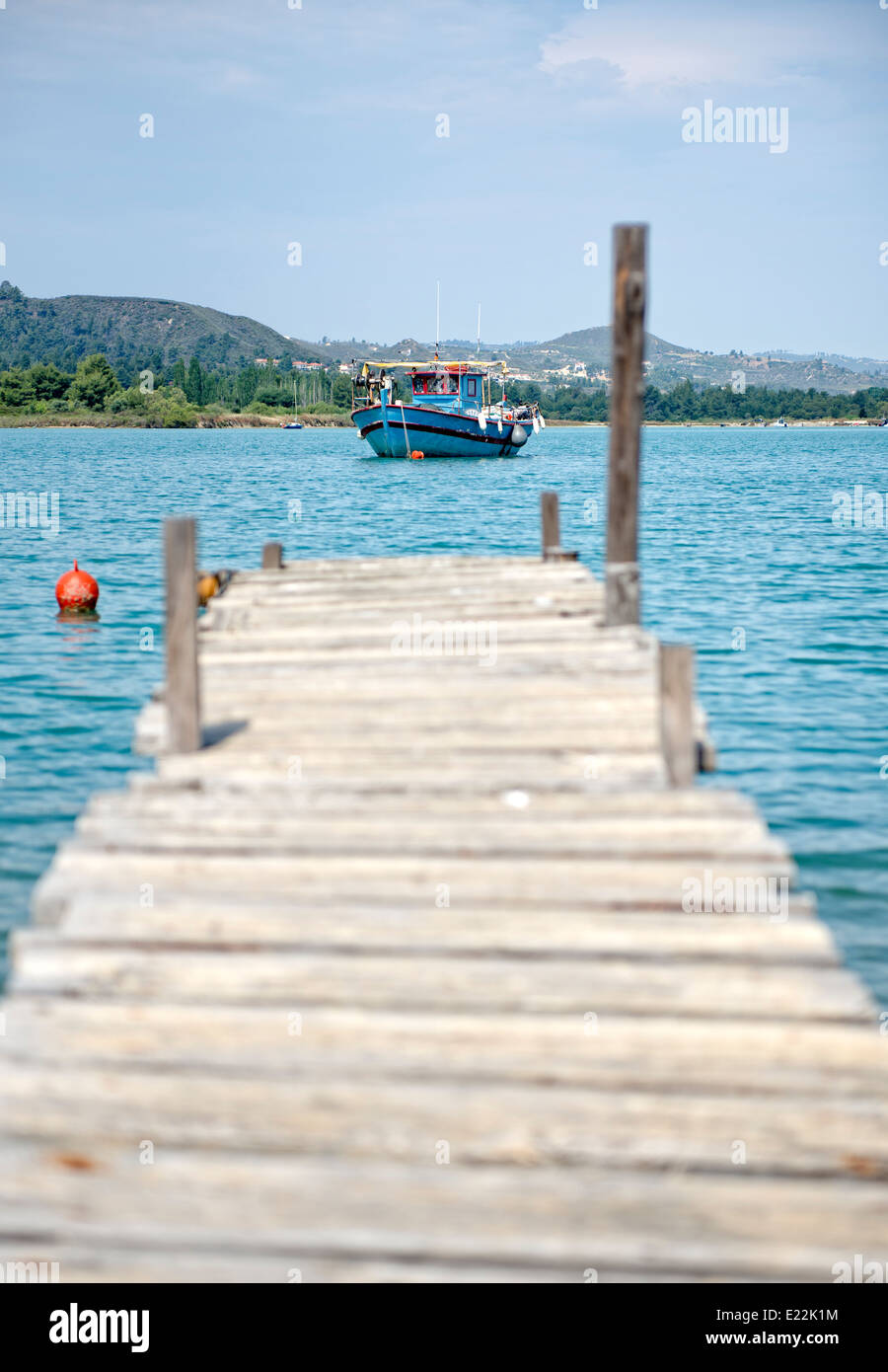 Fishing boat and Jetty Stock Photo - Alamy