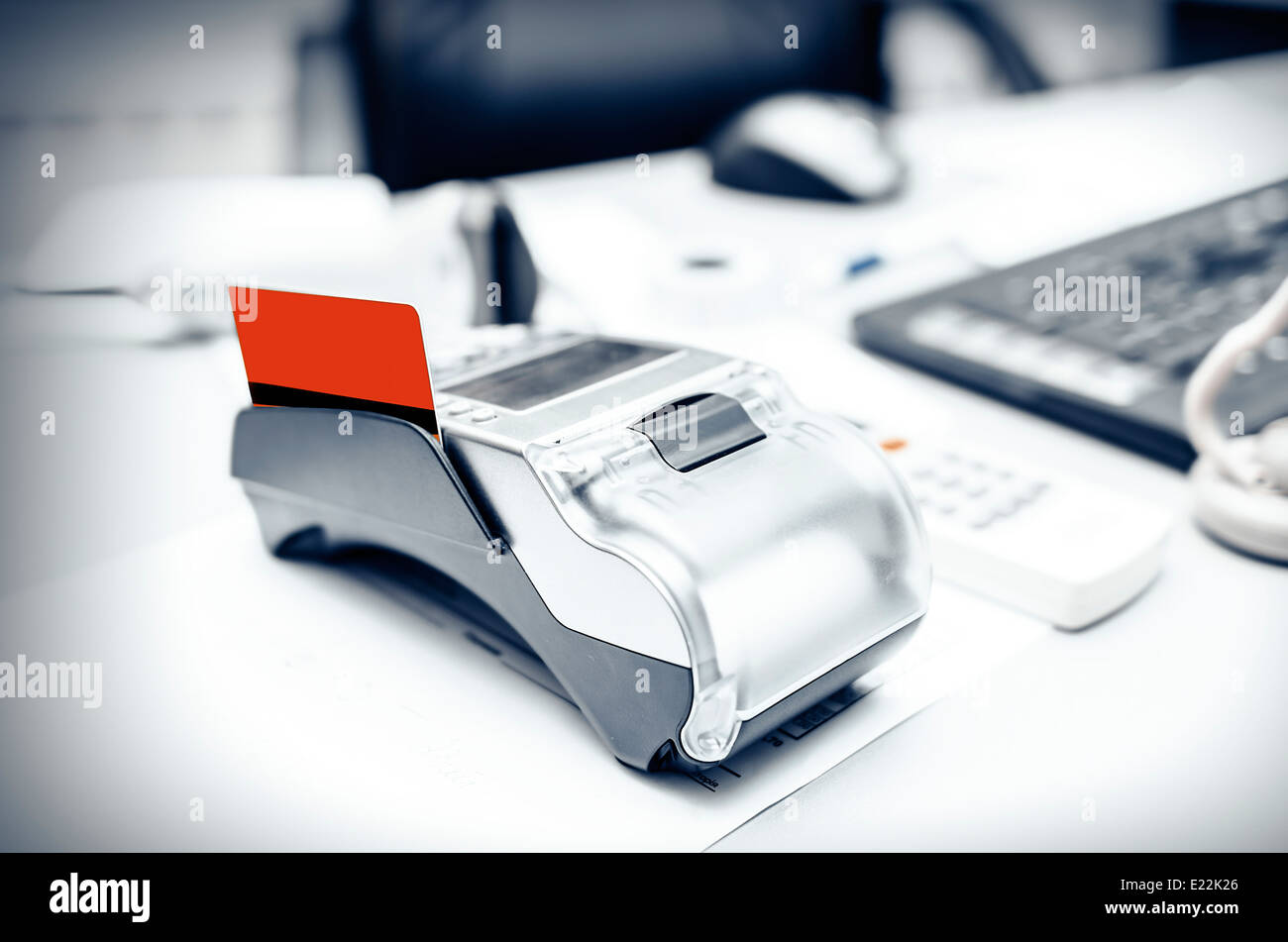 Bank terminal and payment card on the office table Stock Photo - Alamy