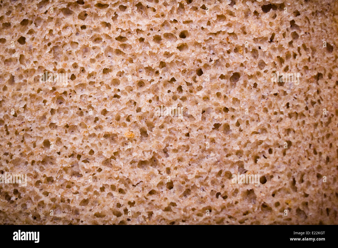 rye bread porous. textured surface is a piece of bread. macro Stock ...