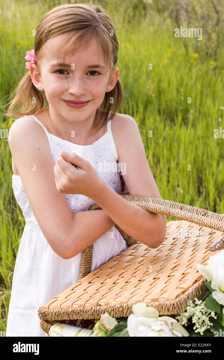 Cute girl with picnic basket in the countryside Stock Photo - Alamy