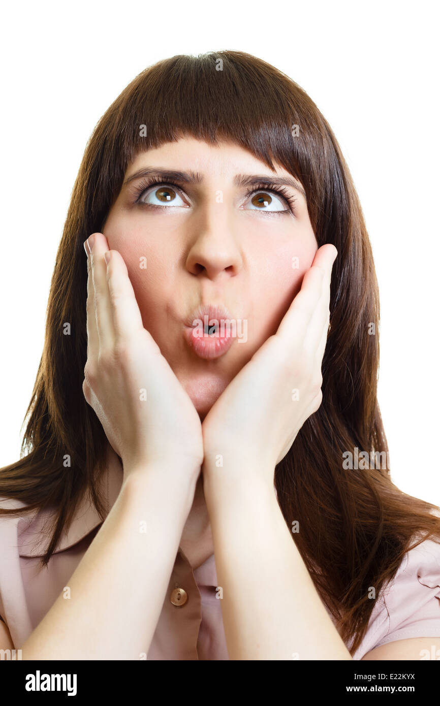 Surprised young woman on an isolated white background Stock Photo - Alamy
