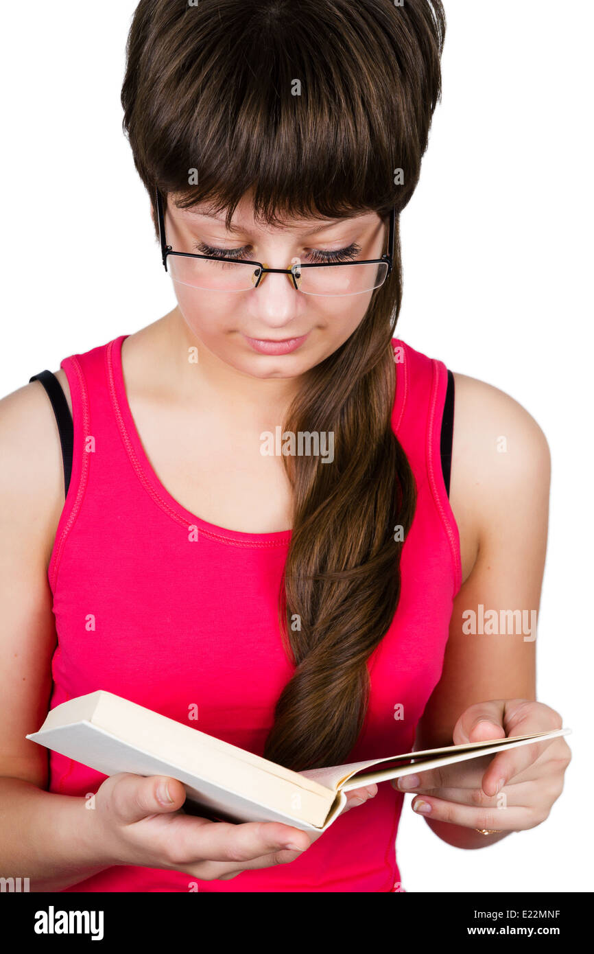 young beautiful girl with glasses reading a book. isolated on white ...
