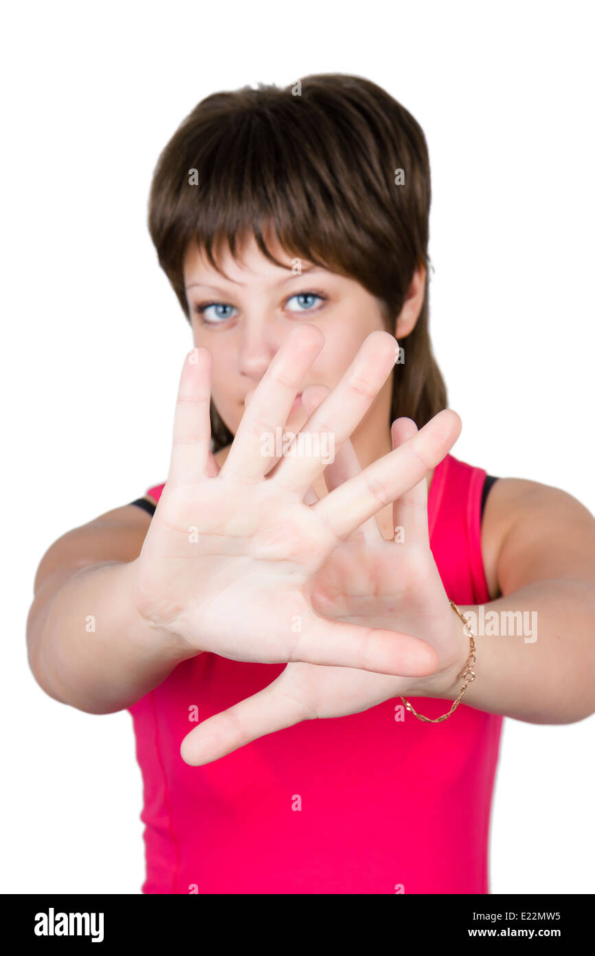 young beautiful girl hiding behind her hands. isolated on white ...