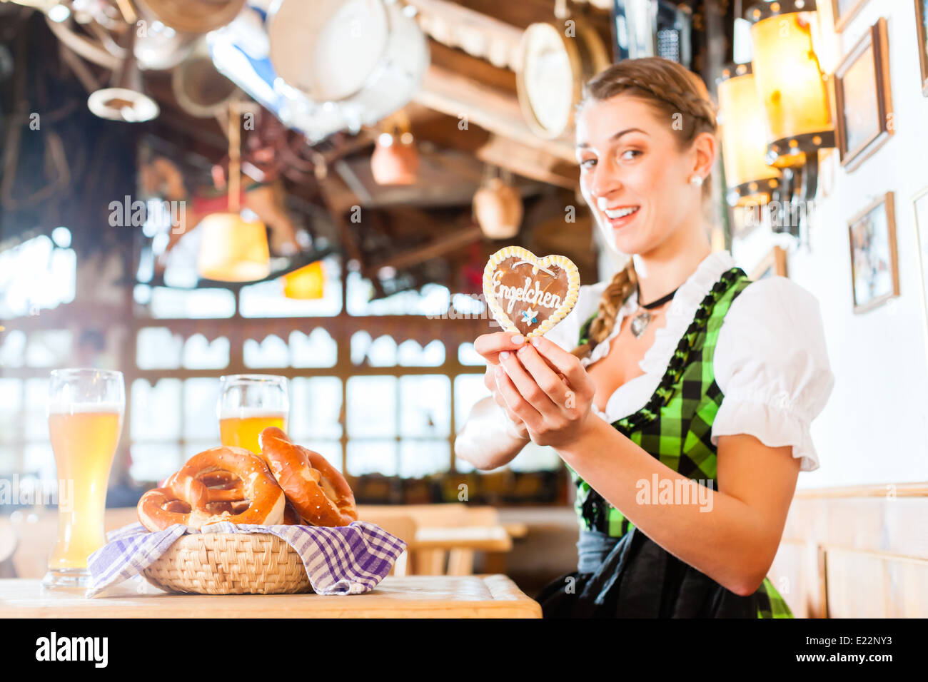 Beautiful woman wearing traditional dirndl hi-res stock photography and ...