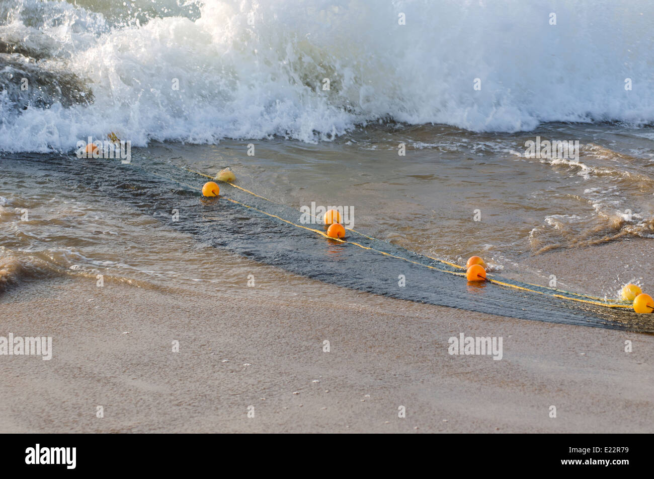 fishing nets rope and floats in sea water, India Stock Photo - Alamy