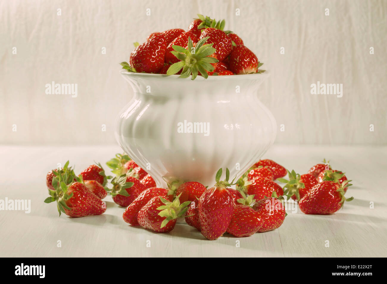 Ripe strawberry on a wooden background with retro filter effect Stock ...