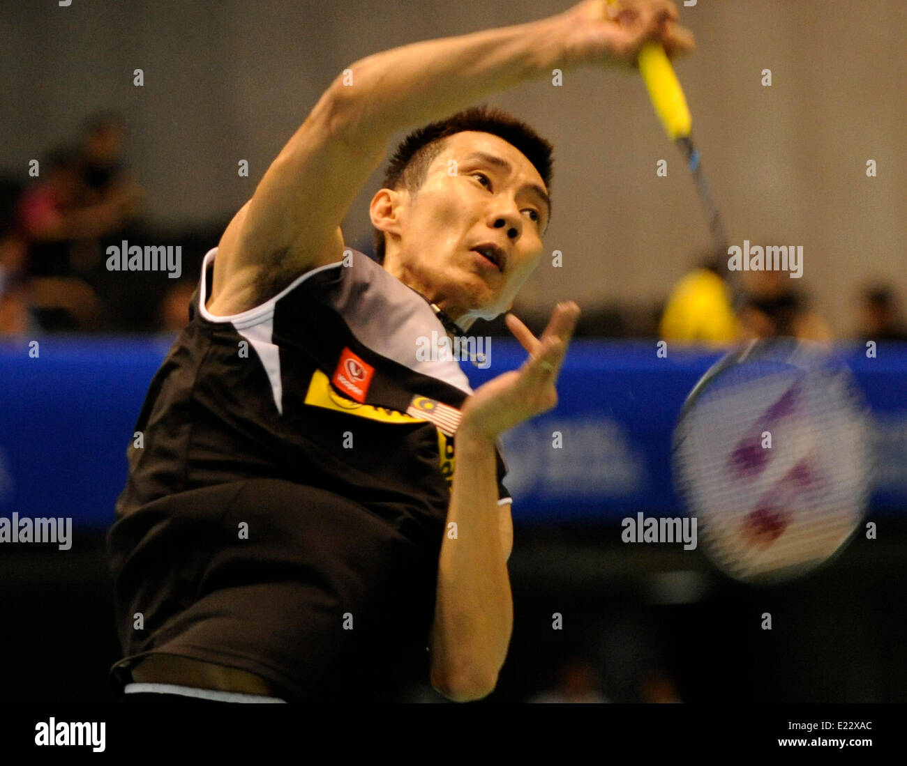 Tokyo, Japan. 14th June, 2014. Lee Chong Wei of Malaysia hits a return against Kenichi Tago of ...
