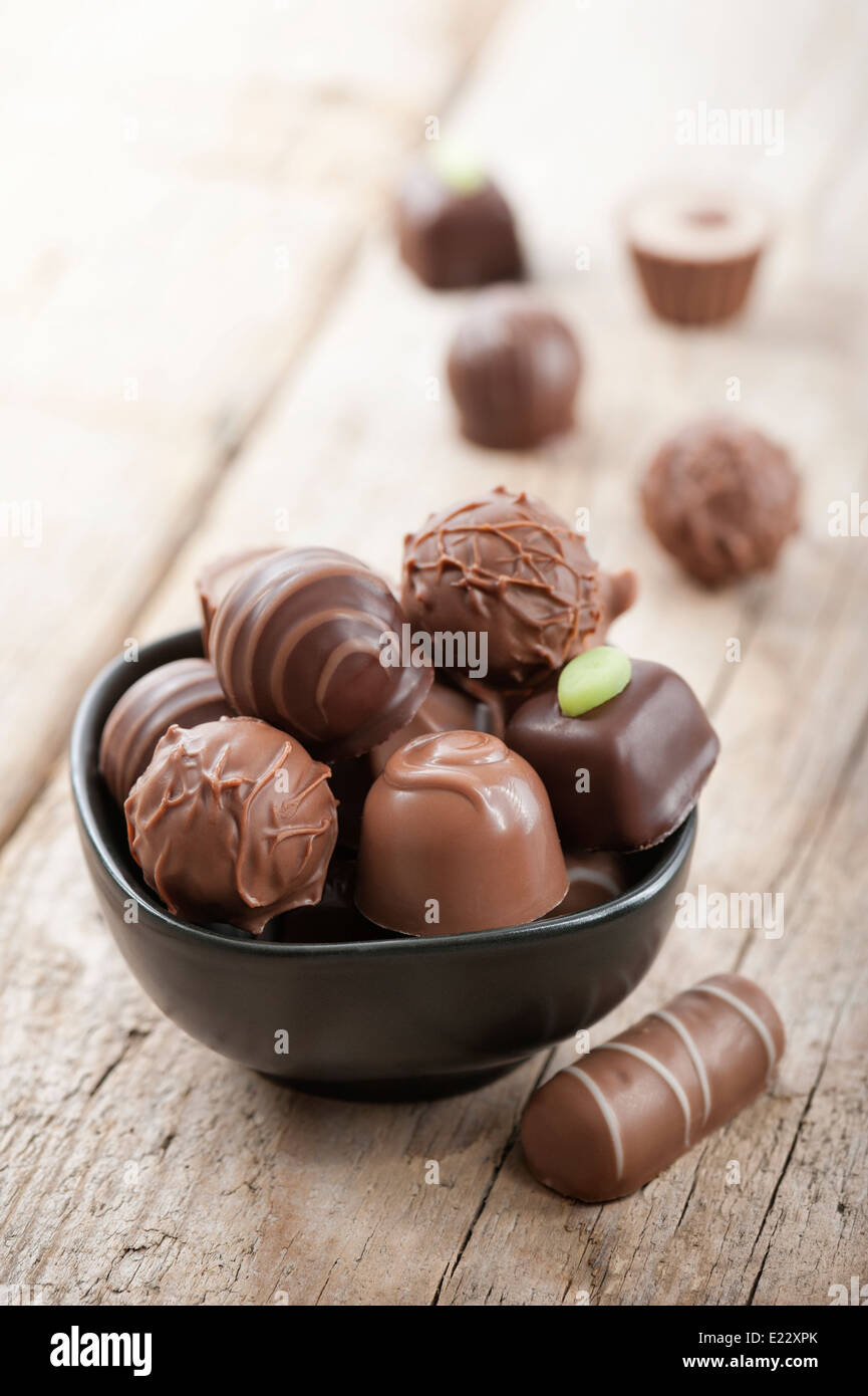 assorted chocolates confectionery in a black bowl Stock Photo - Alamy