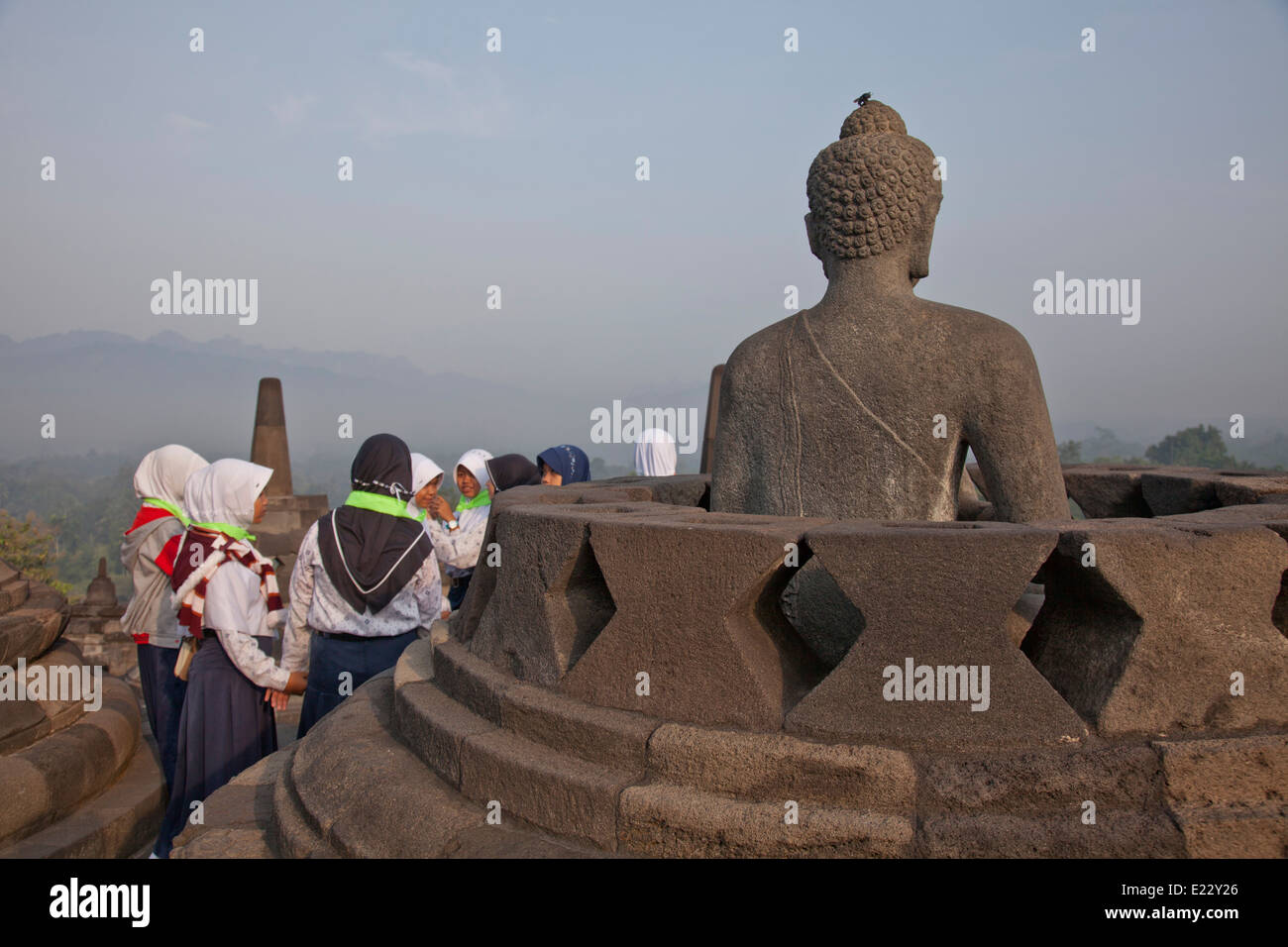 Muslim girls visiting the ancient Borobudur Buddhist temple near ...