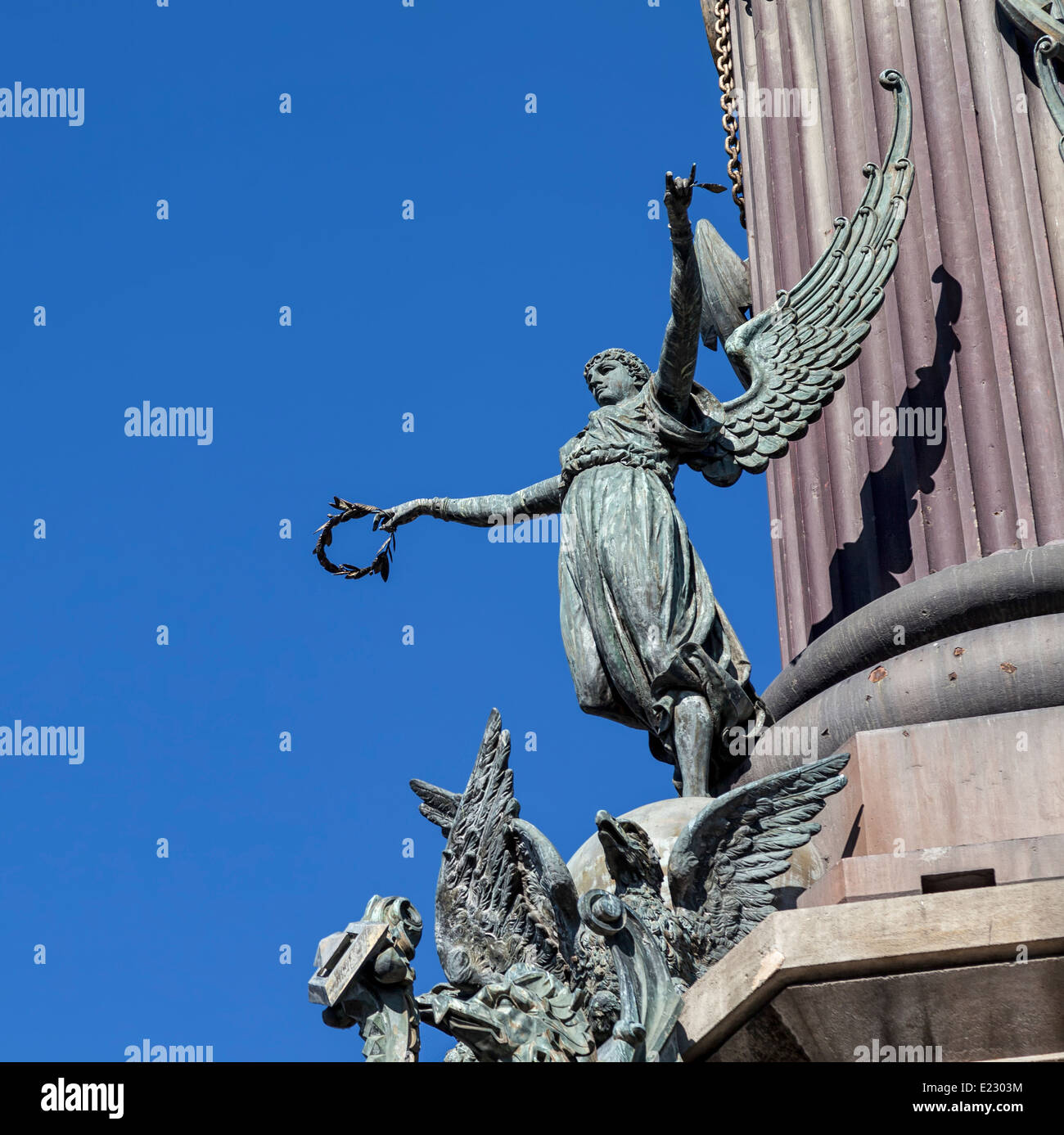Winged figure on the Columbus monument in Barcelona Stock Photo - Alamy