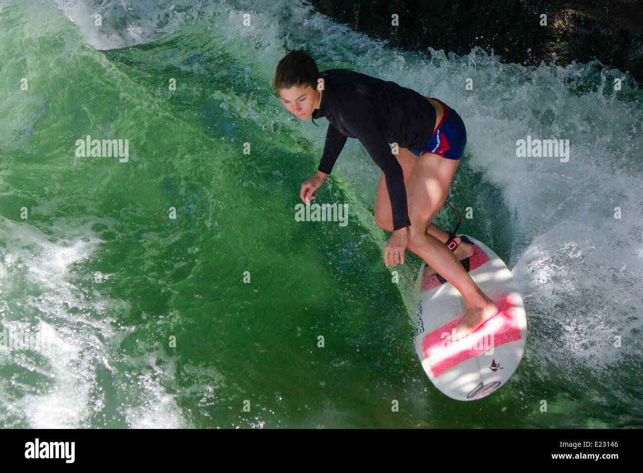 Female surfing wave hi-res stock photography and images - Alamy