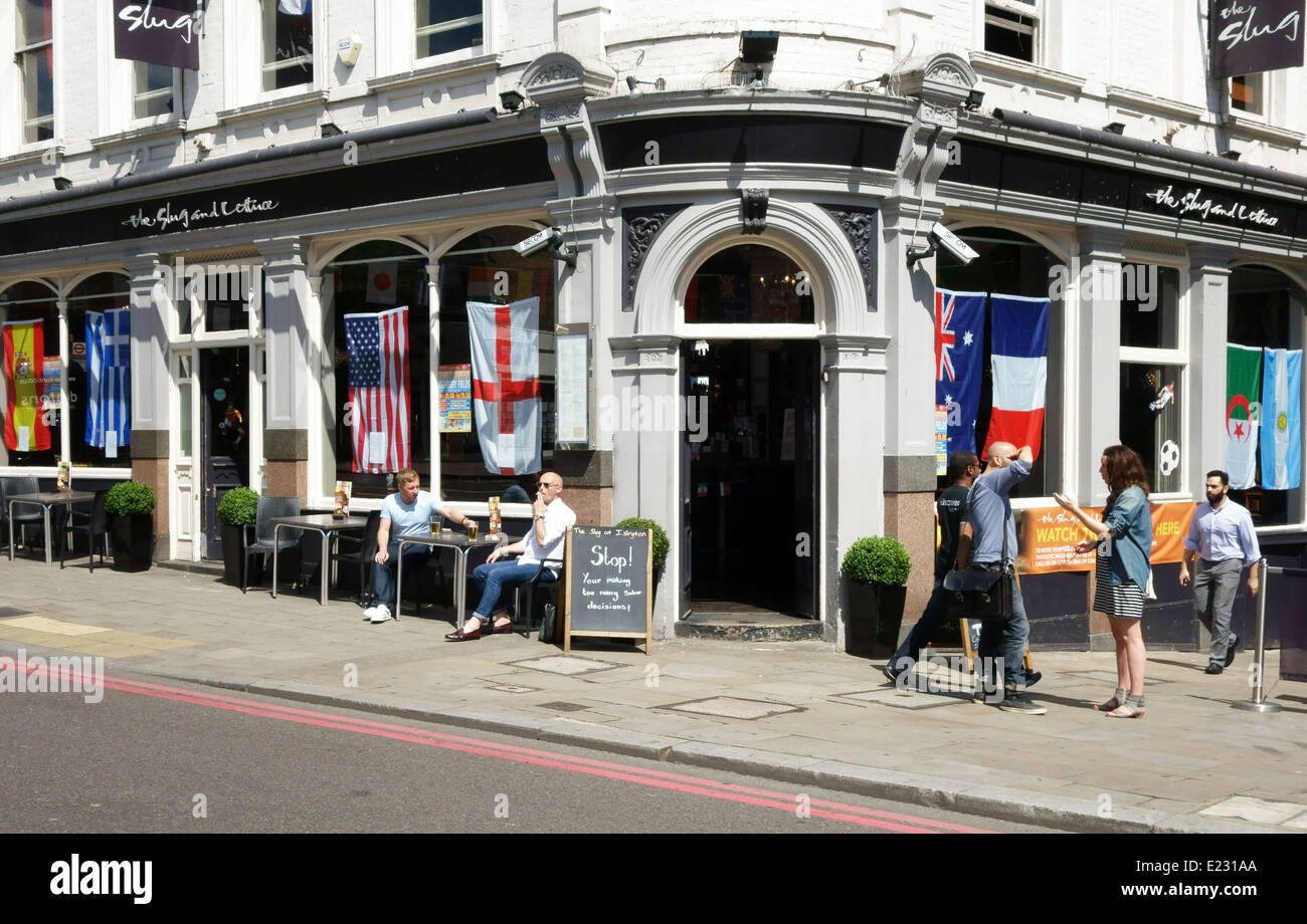 National flags on London pub showing World Cup matches 2014 Stock Photo ...