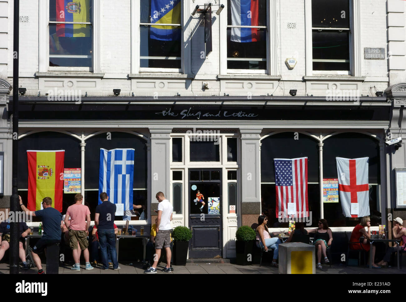 National flags on London pub showing World Cup matches 2014 Stock Photo ...