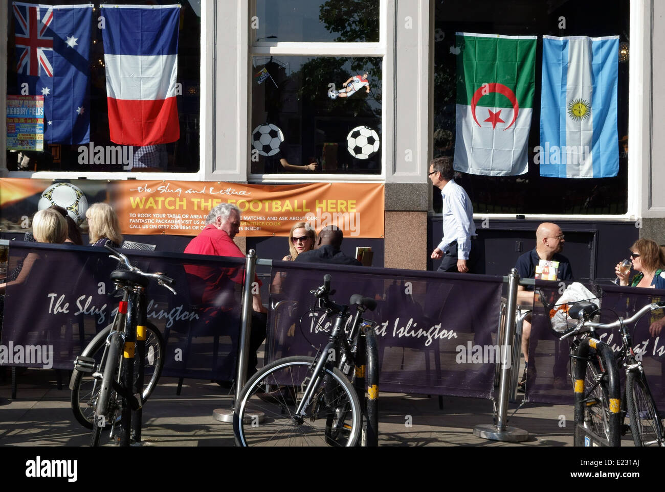 National flags on London pub showing World Cup matches 2014 Stock Photo ...