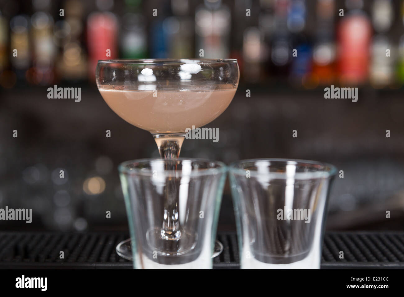 mix alcohol cocktail in glass on bar for party Stock Photo - Alamy